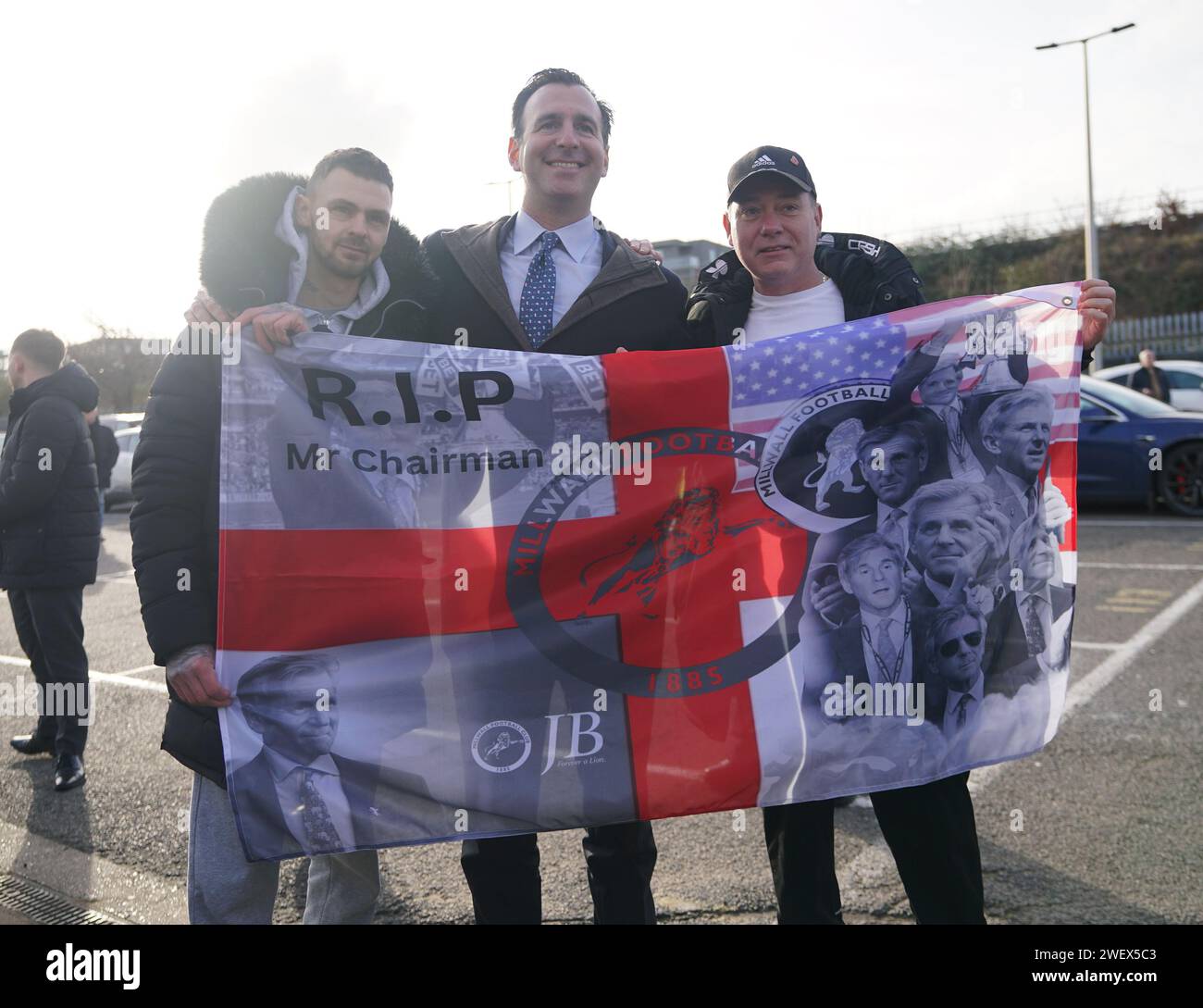 Millwall chairman James Berylson (centre)poses with fans holding a ...