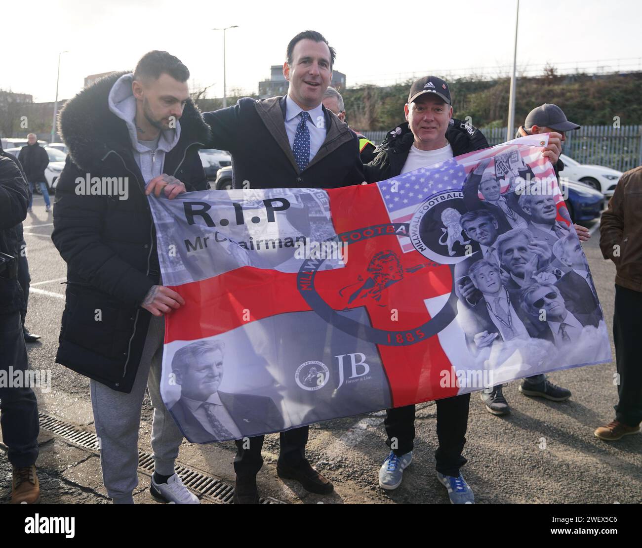 Millwall chairman James Berylson (centre)poses with fans holding a ...