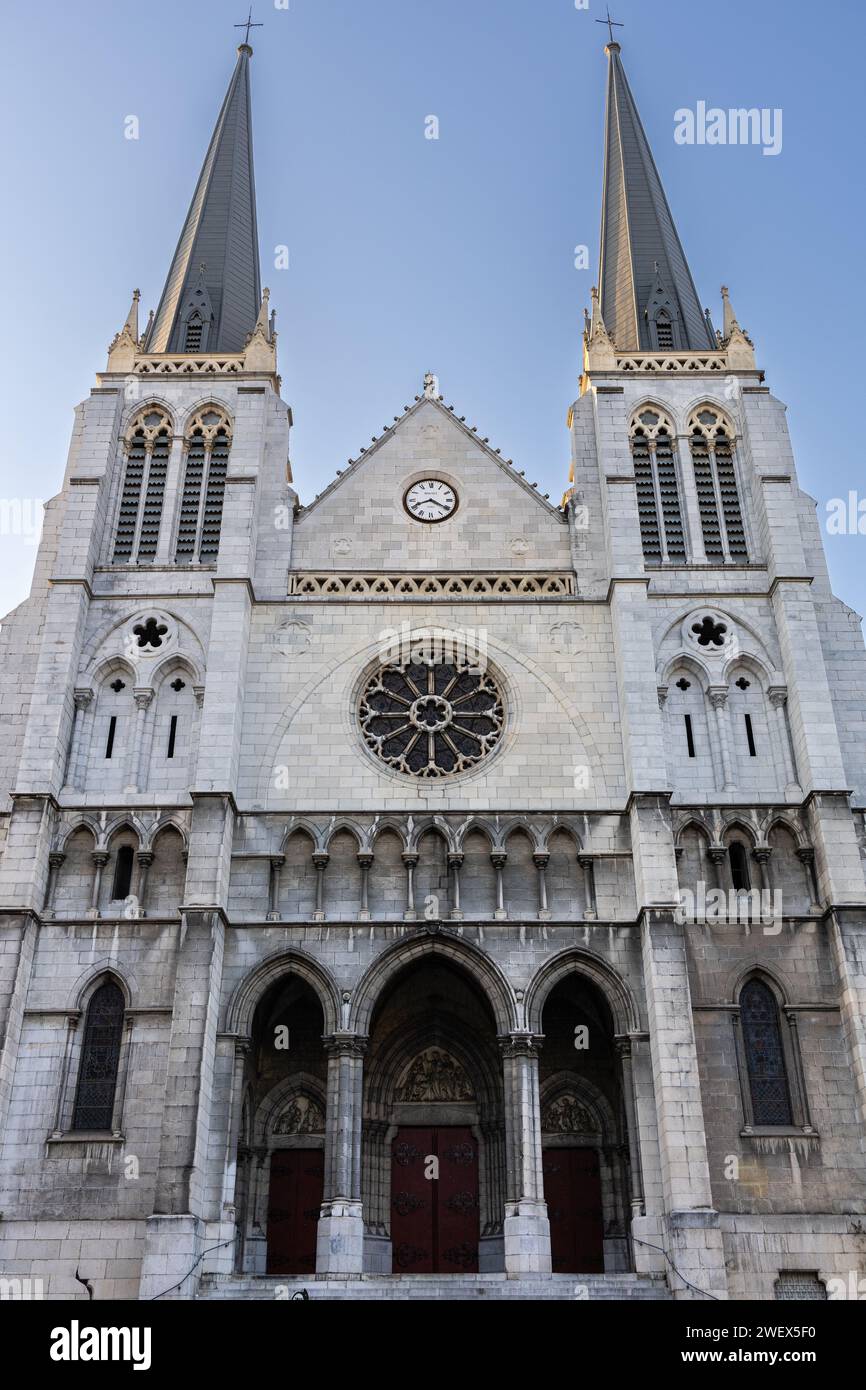 The facade of Saint-Jacques church, a neo-Gothic style building with ...