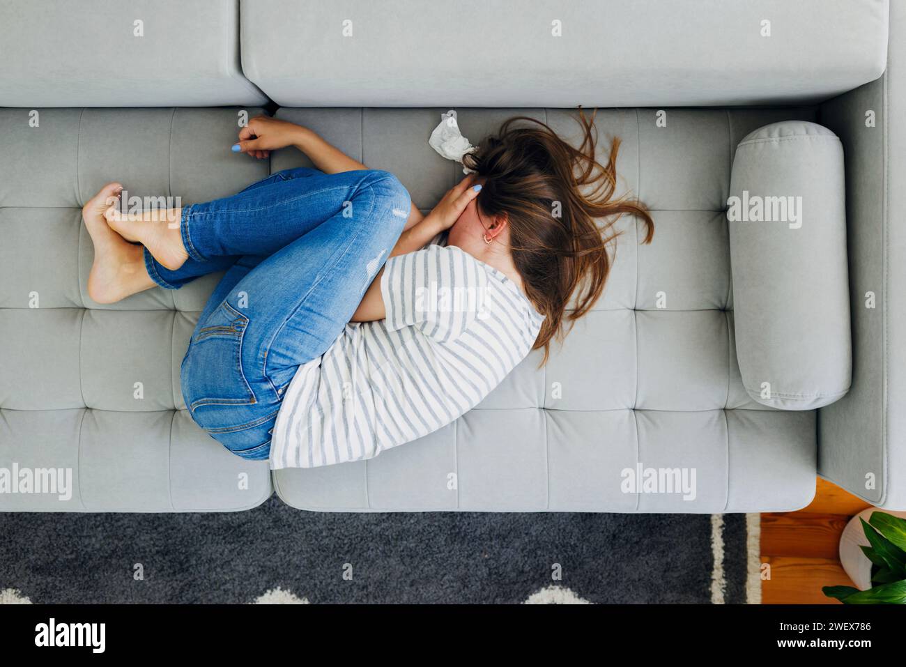 Heartbroken woman crying home hi-res stock photography and images - Alamy