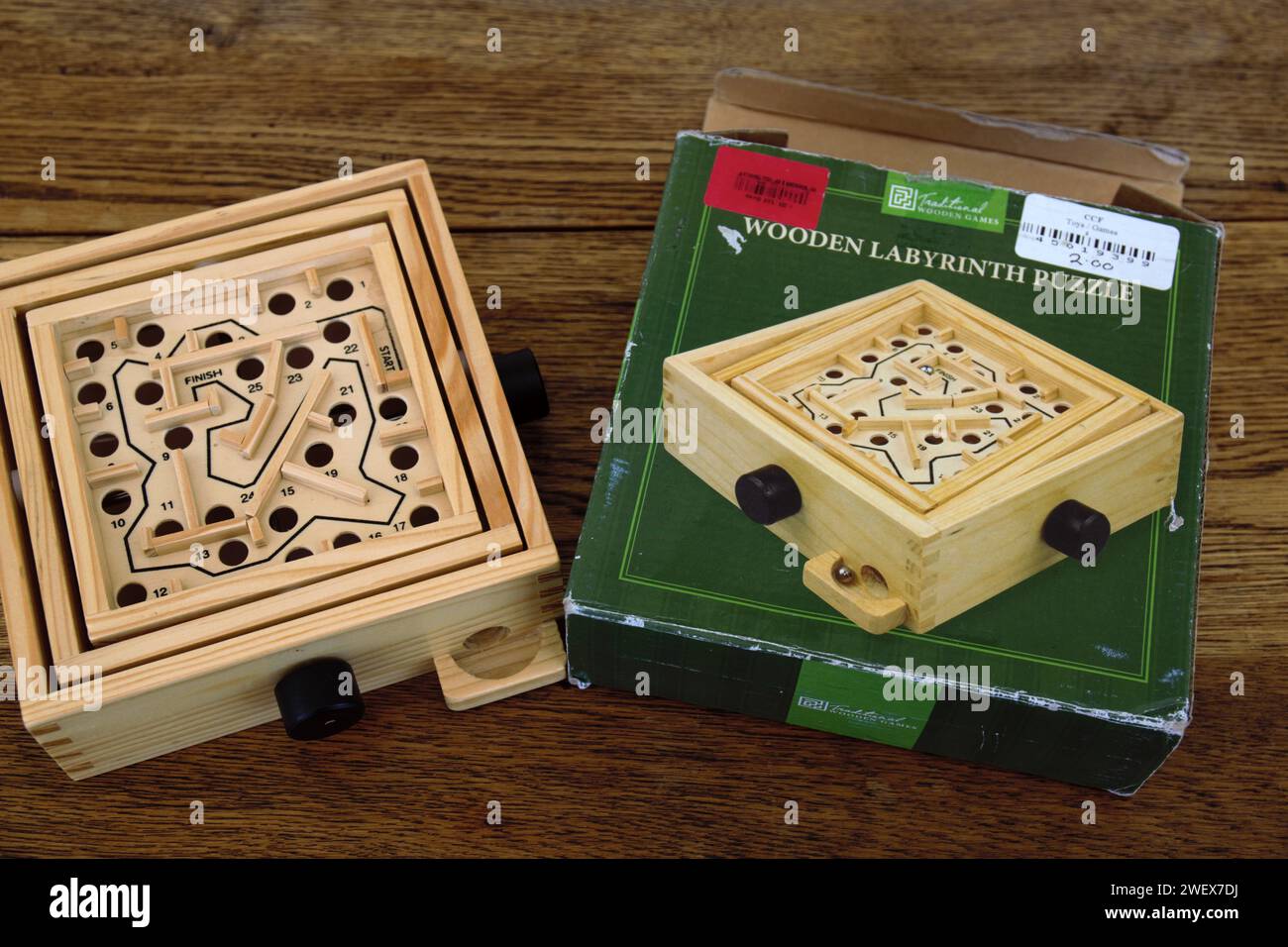 Labyrinth, wooden puzzle maze game and toy. Try to tilt the playfield ...