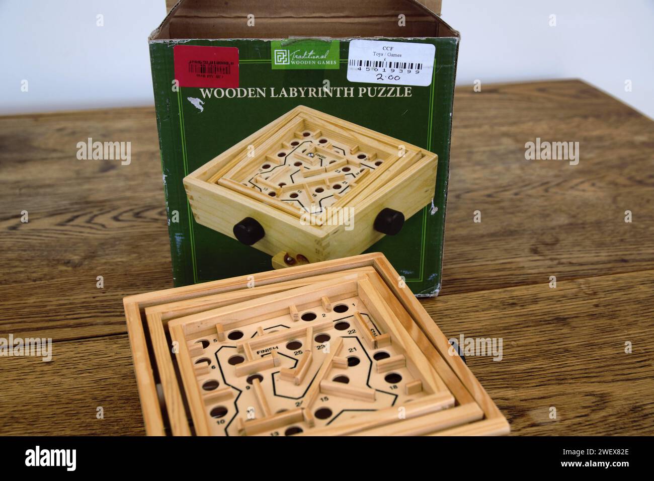 Labyrinth, wooden puzzle maze game and toy. Try to tilt the playfield ...