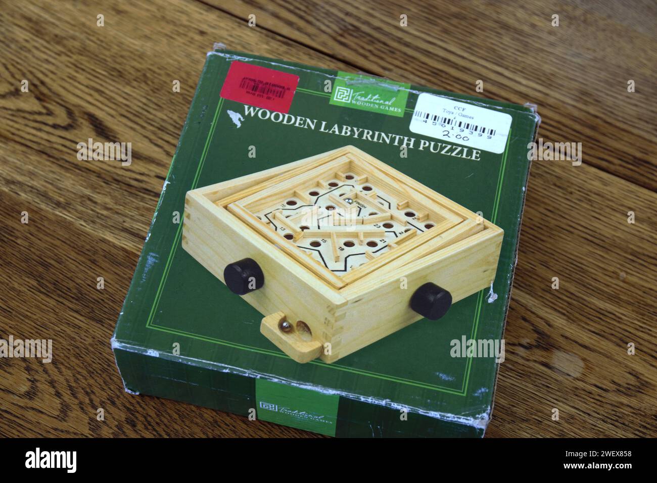 Labyrinth, wooden puzzle maze game and toy. Try to tilt the playfield ...