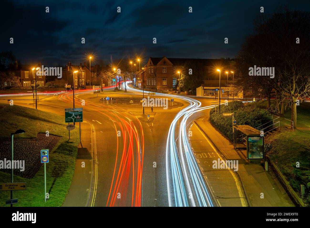 Night view of a busy small roundabout in a town Stock Photo - Alamy