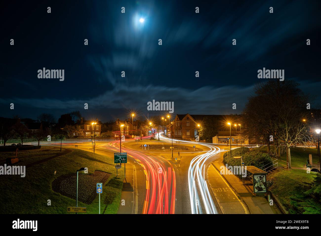 Night view of a busy small roundabout in a town Stock Photo - Alamy