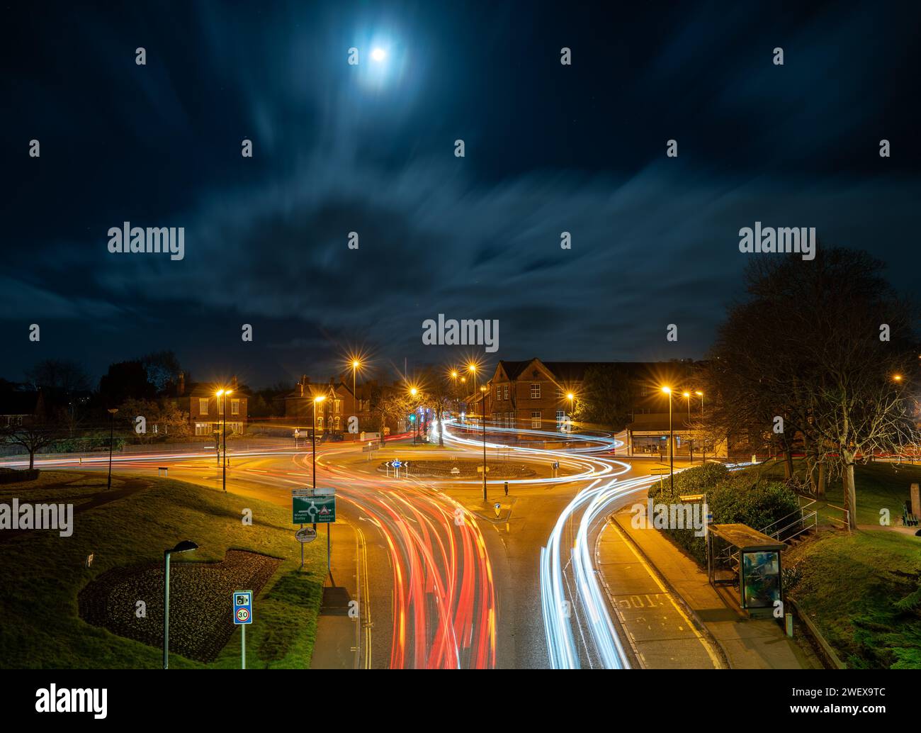 Night view of a busy small roundabout in a town Stock Photo - Alamy