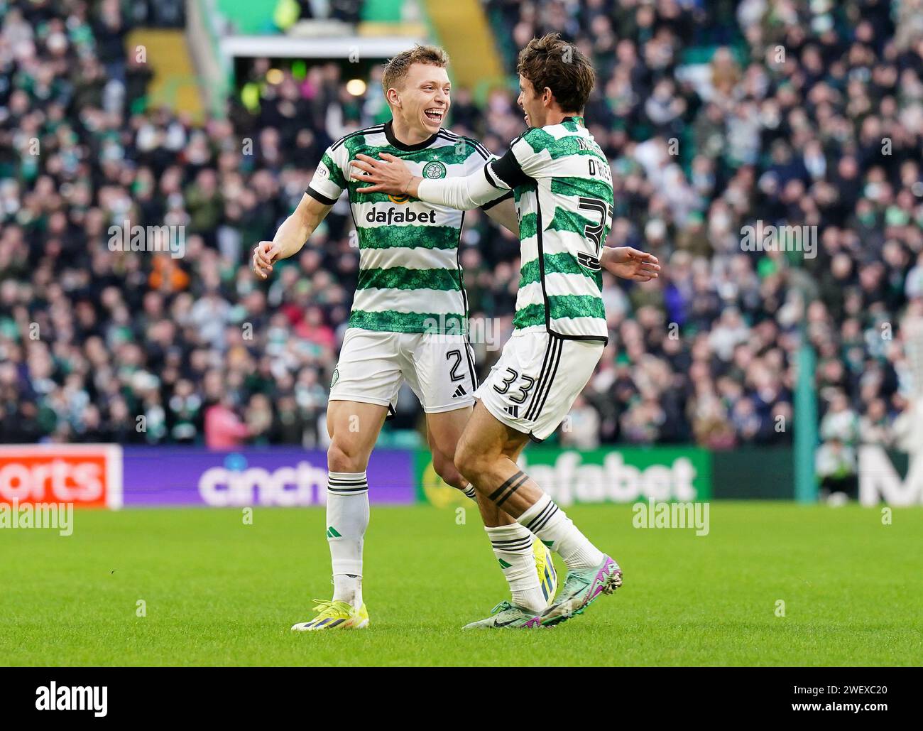 Celtic's Alistair Johnston (left) celebrates scoring their side's first ...