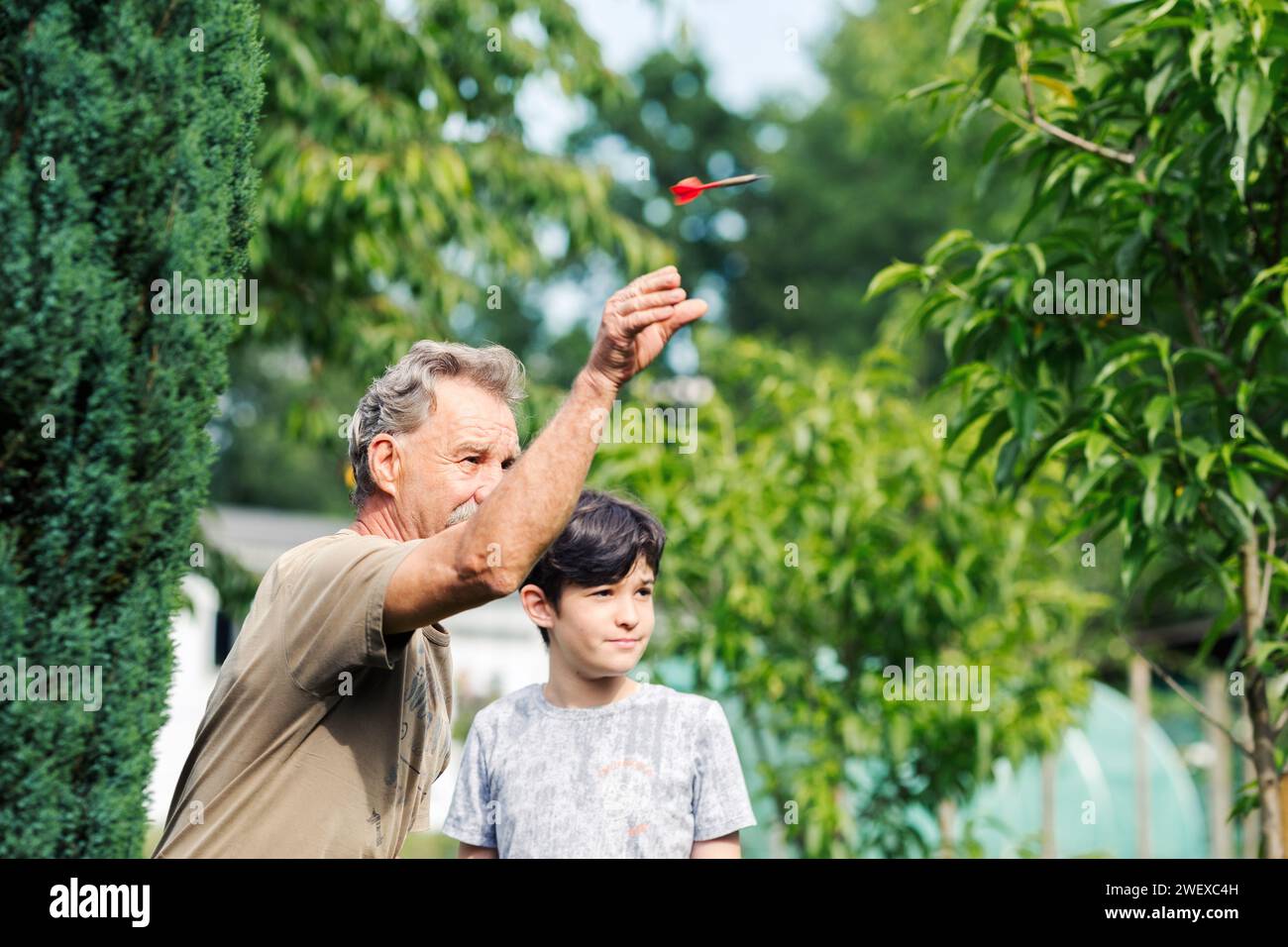 Man playing a game of darts. He needs concentration and perfection to ...