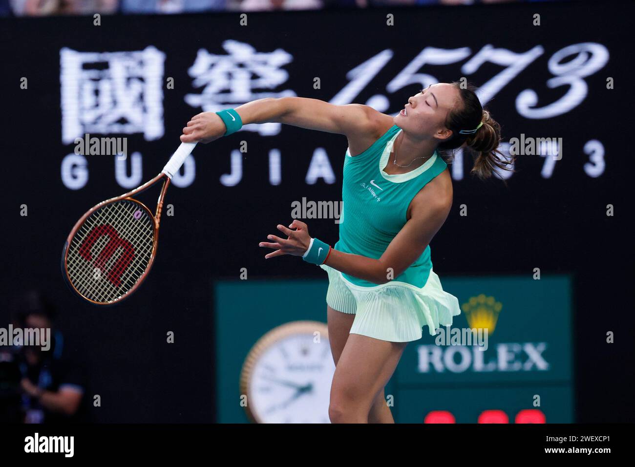 Qinwen Zheng (CHN) in action during their finals match against Aryna ...