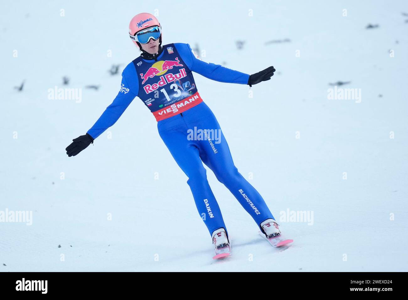 Dawid Kubacki, of Poland, reacts after his final round jump of the ski flying world ...