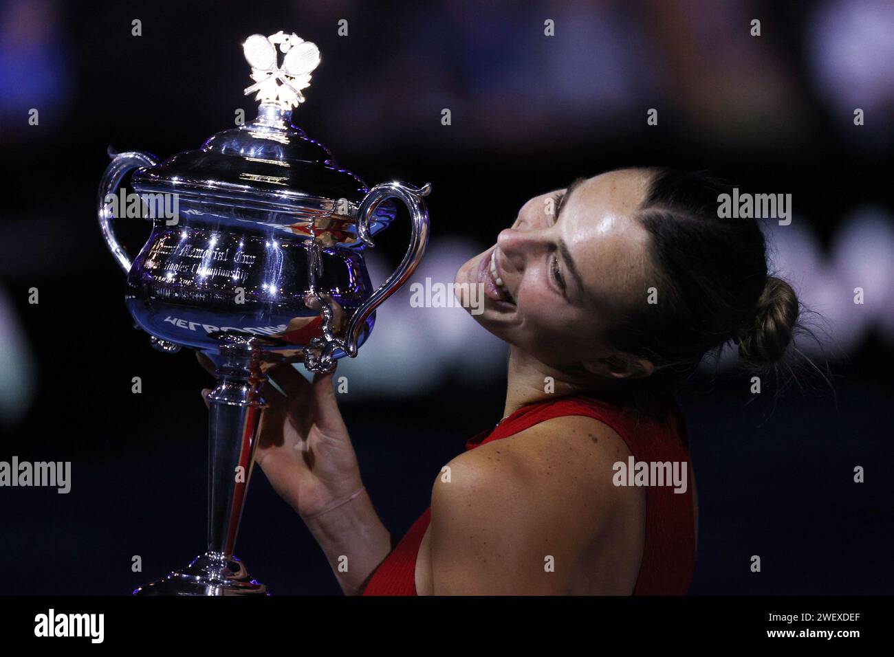 Aryna Sabalenka lifts the trophy after won the finals against Qinwen Zheng (CHN) on day 14 of ...