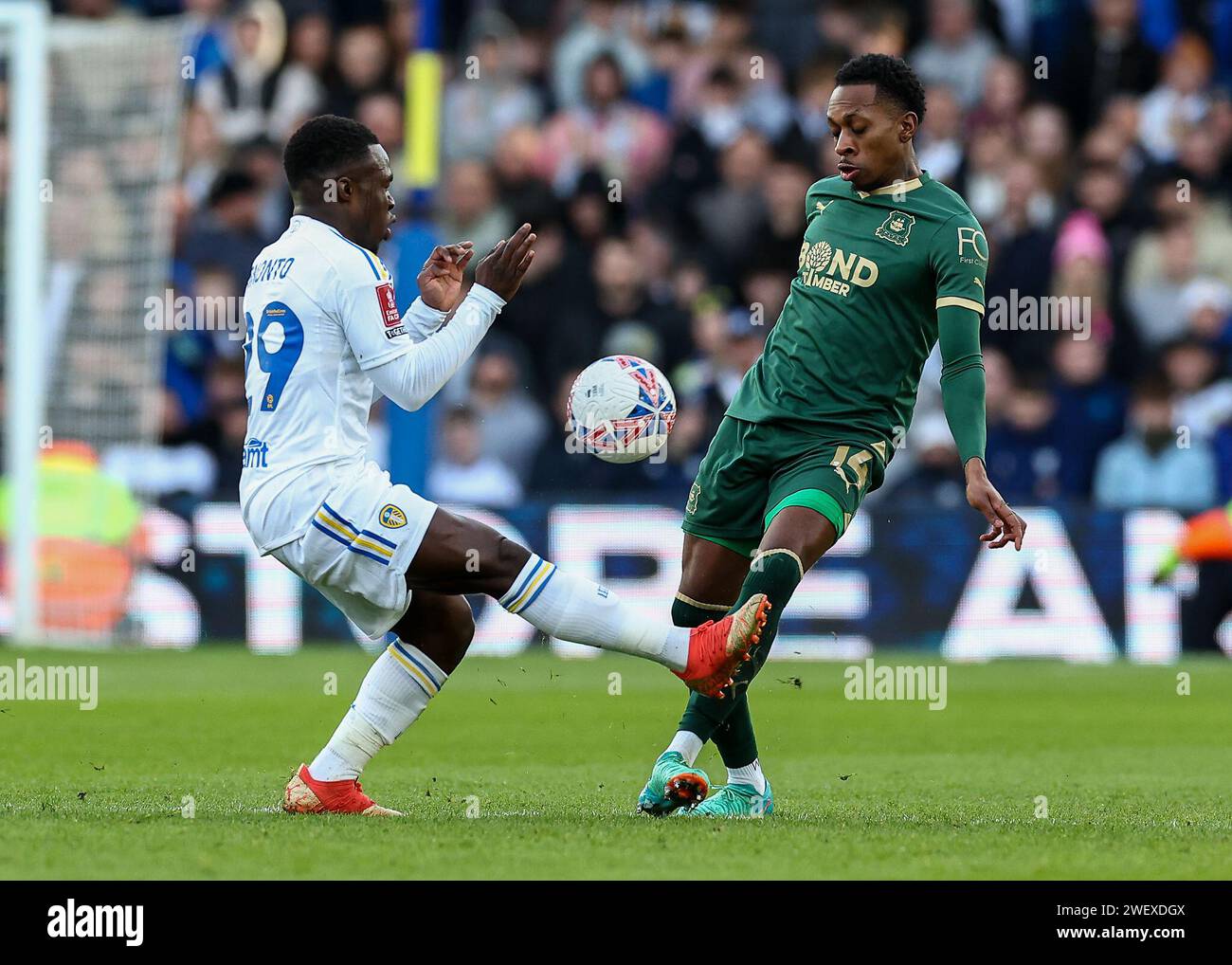 Mickel Miller of Plymouth Argyle battles for the ball with Wilfried ...