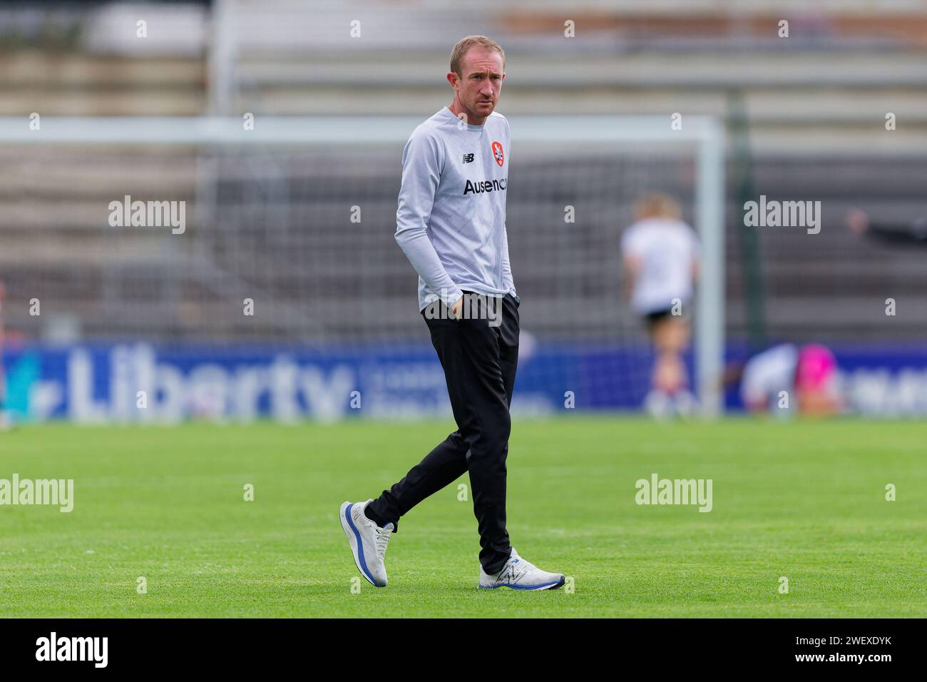 Coach, Alex Smith of Brisbane Roar overseas the warm up session before ...