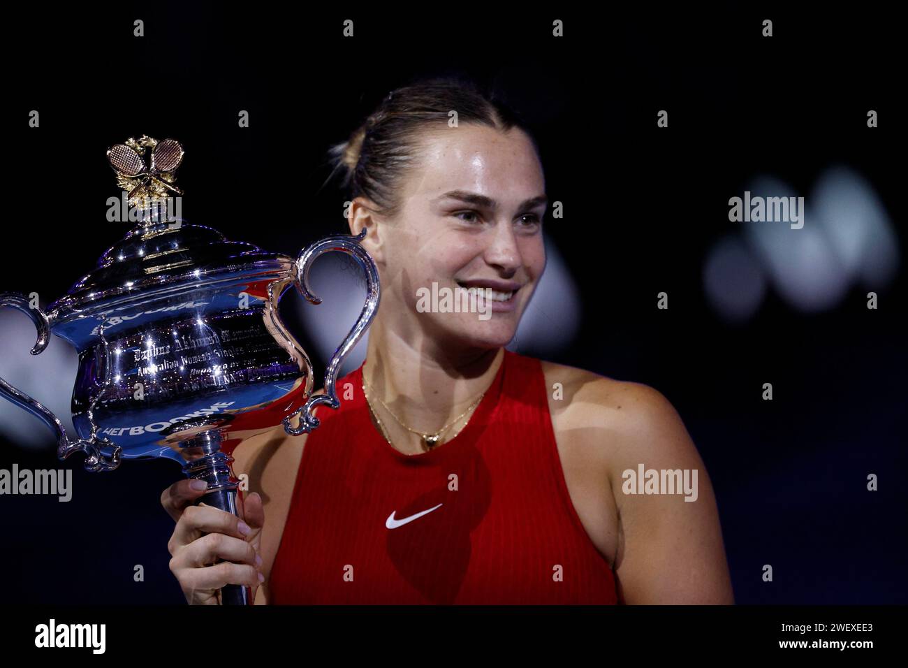 Aryna Sabalenka lifts the trophy after won the finals against Qinwen Zheng (CHN) on day 14 of ...