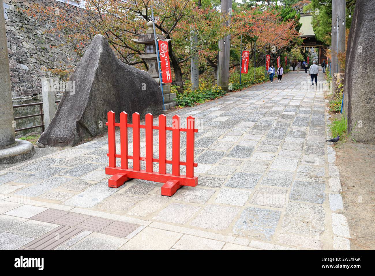 The red fence forbids vehicles from approaching the walkway leading to ...