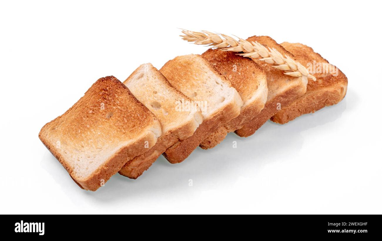 Crispy golden toasted white bread slices on a clean white table ...