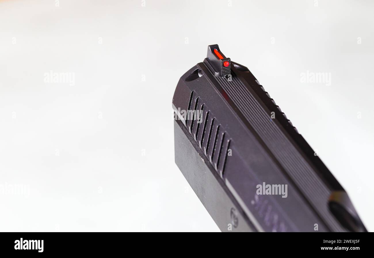 Fiber optic front gun sight on a semi automatic handgun Stock Photo - Alamy
