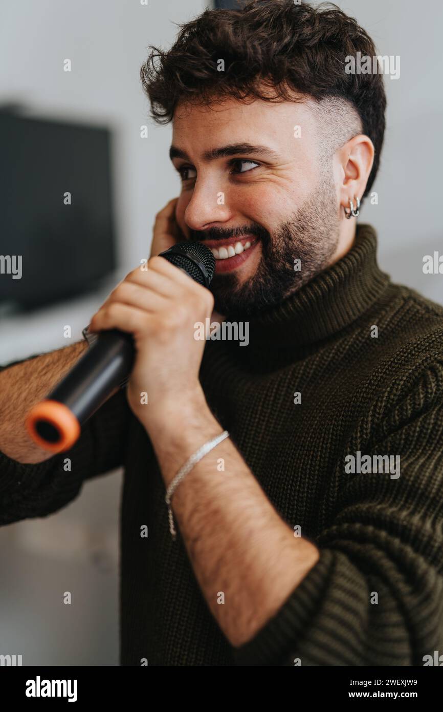 Positive atmosphere concept. Businessman singing on microphone at ...