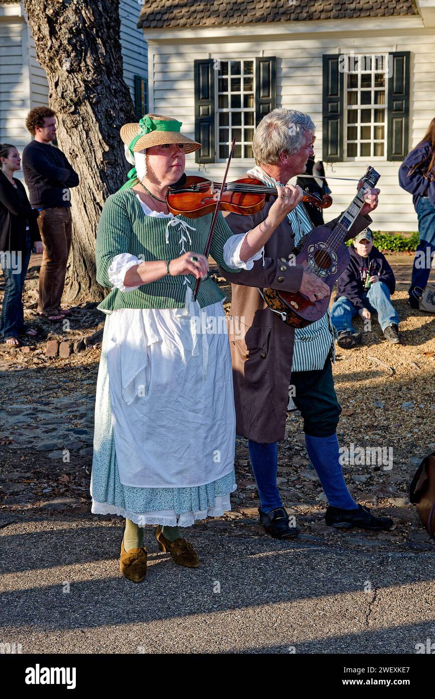 musicians playing, man, woman, violin, guitar, on street, dressed in ...