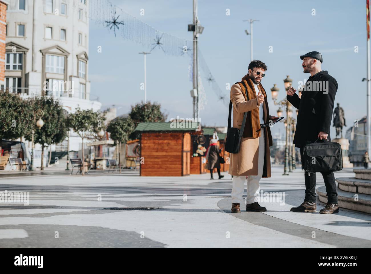 Two stylish men engaging in casual business meeting outdoors Stock ...