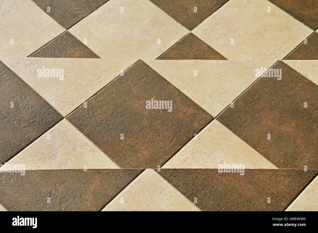 Concrete stairs are decorated with square and triangular ceramic tiles ...