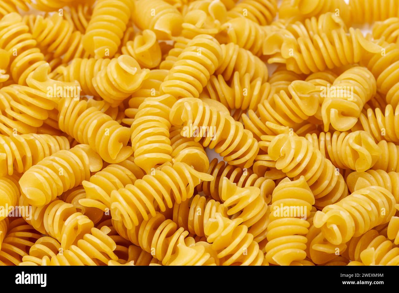 Background from Pasta. Fusilli spirale texture. Top view Stock Photo ...