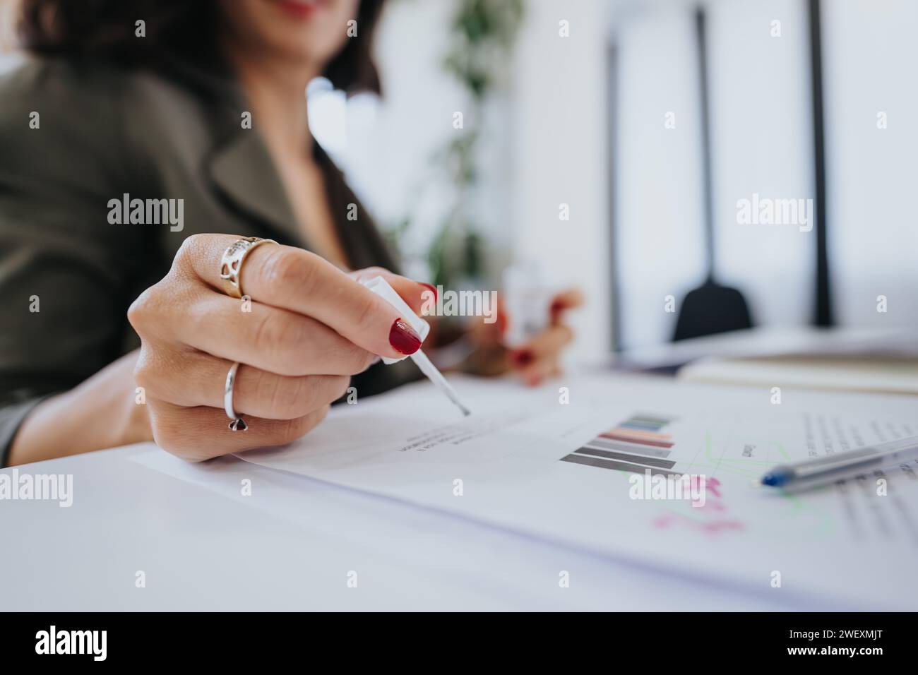 Hands reviewing financial reports charts hi-res stock photography and ...