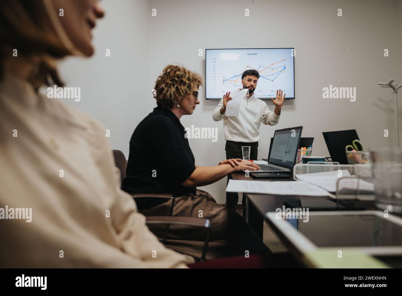 Successful business people collaborating and strategizing in a ...