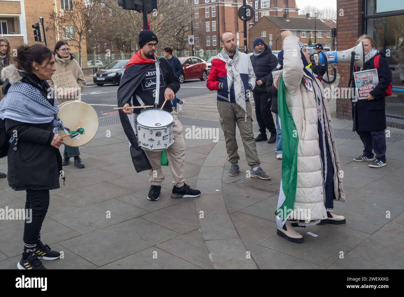London, UK. 27 Jan 2024. People protest outside Barclay's Whitechapel ...