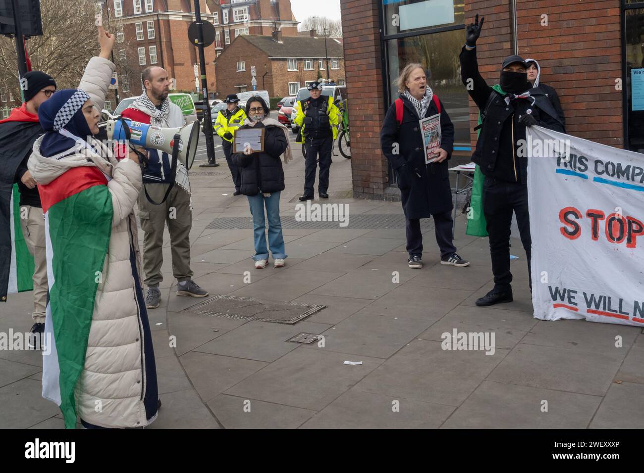 London, UK. 27 Jan 2024. People protest outside Barclay's Whitechapel ...