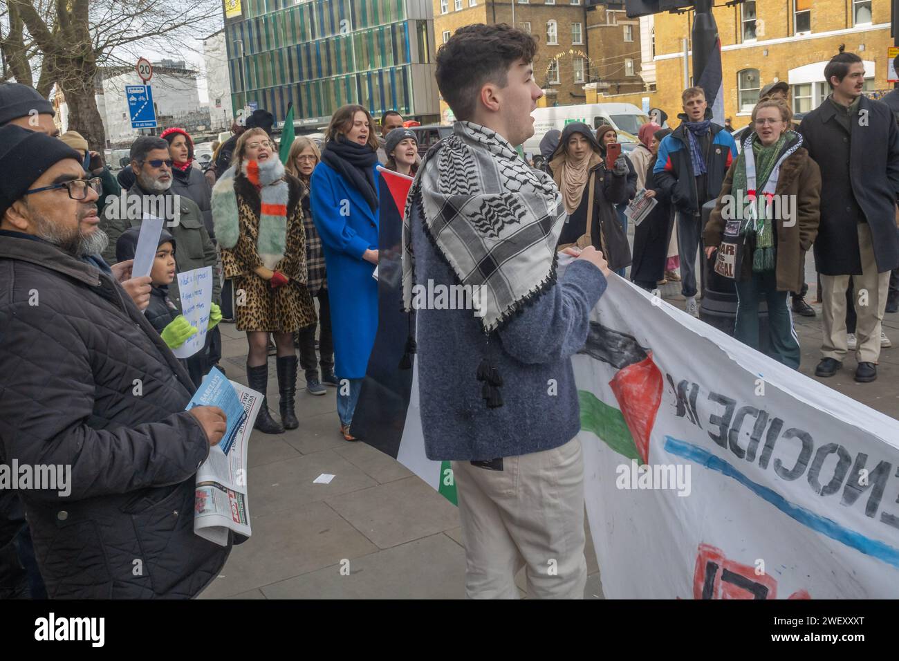 London, UK. 27 Jan 2024. People protest outside Barclay's Whitechapel ...