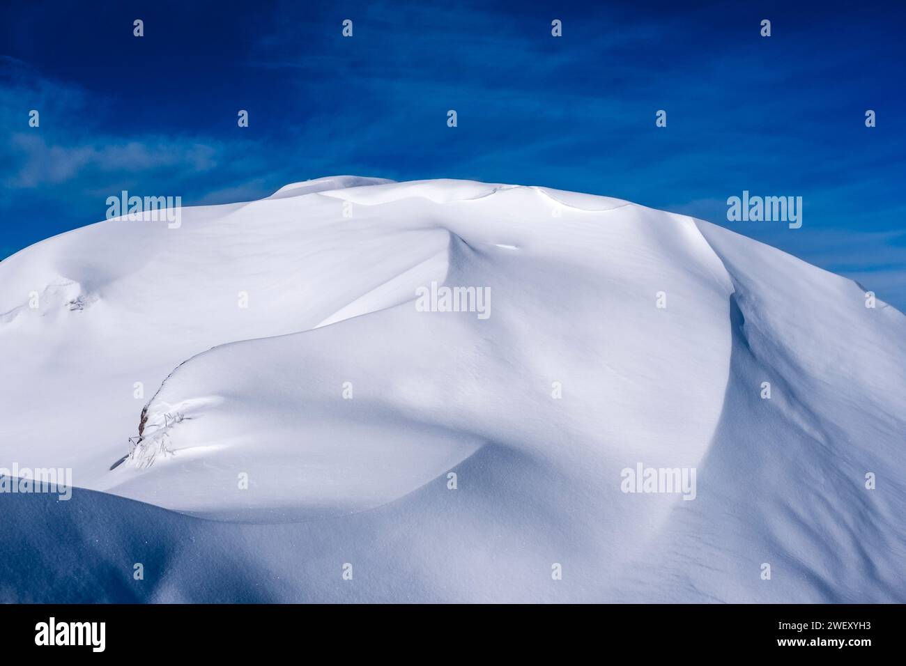 Structures of drifted snow on a hill above Passo Rolle pass in winter ...