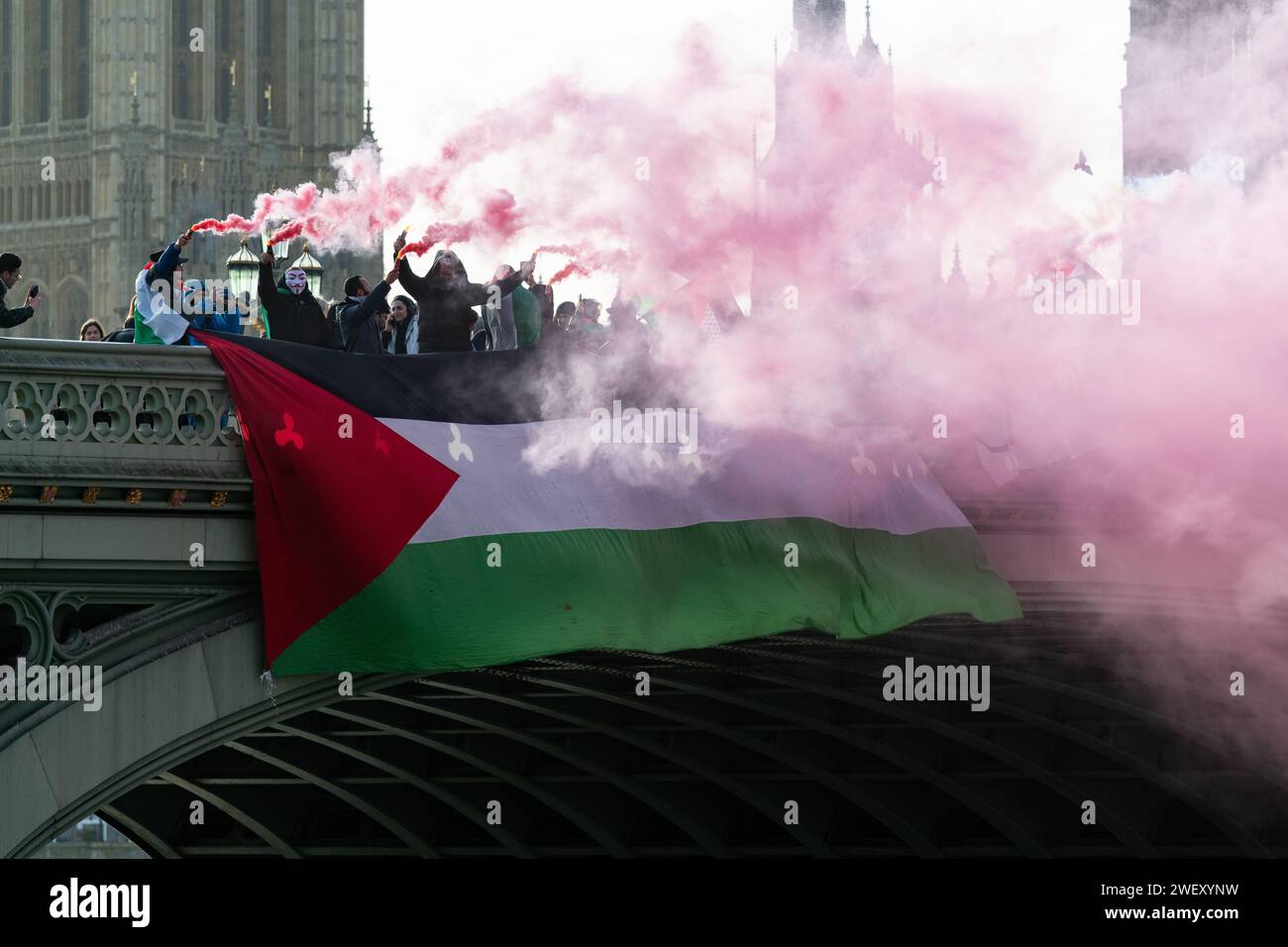 London, UK. 27 January, 2024. Palestine supporters drape a large ...