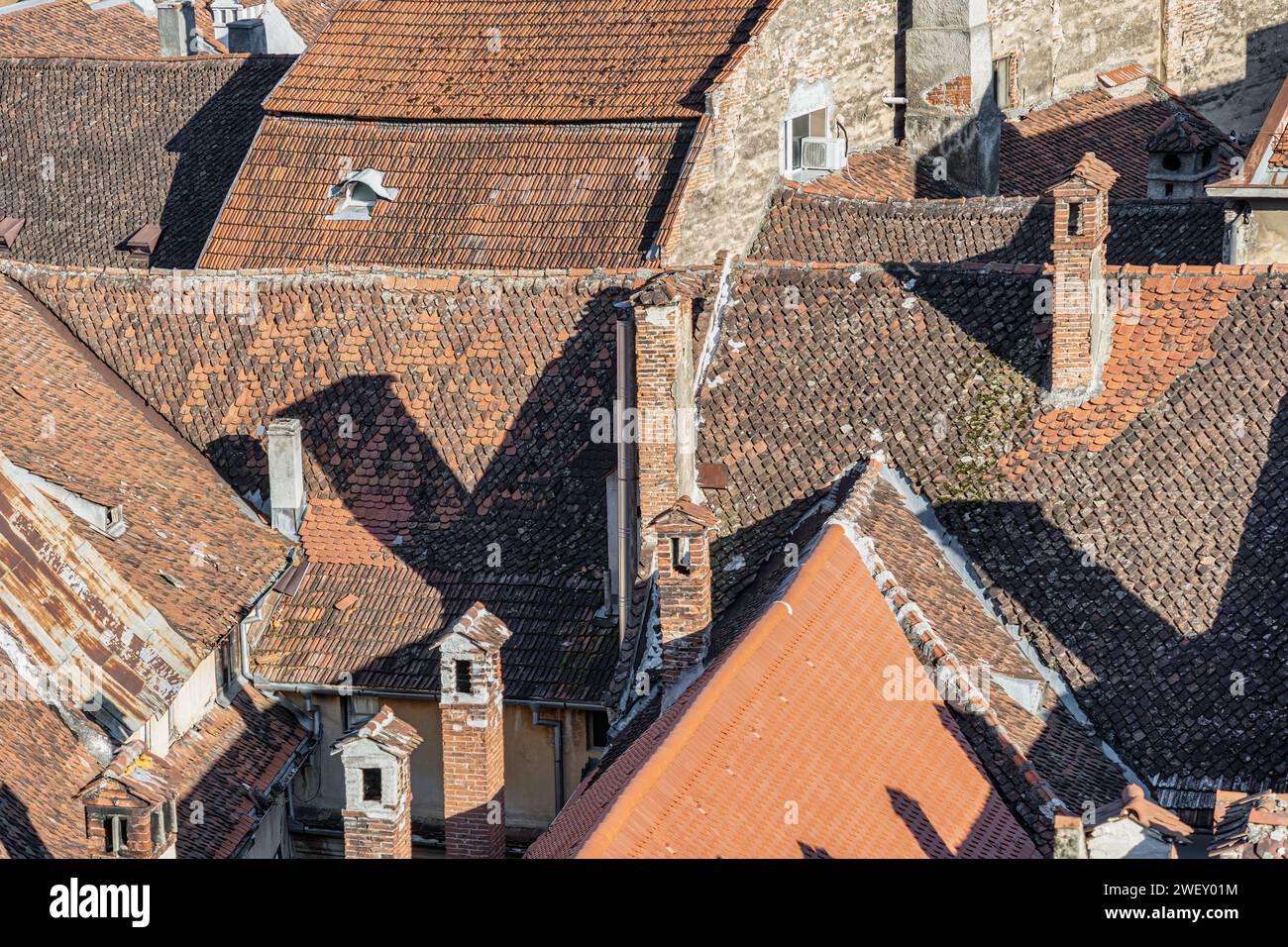 View with the red brick roofs of the houses in the old town of Brasov ...