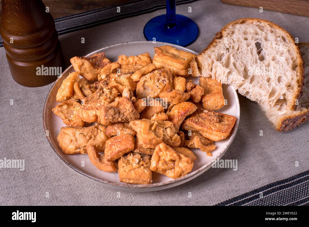 Heap of domestic salty fried pork greaves. Fatty junk food. Pork ...