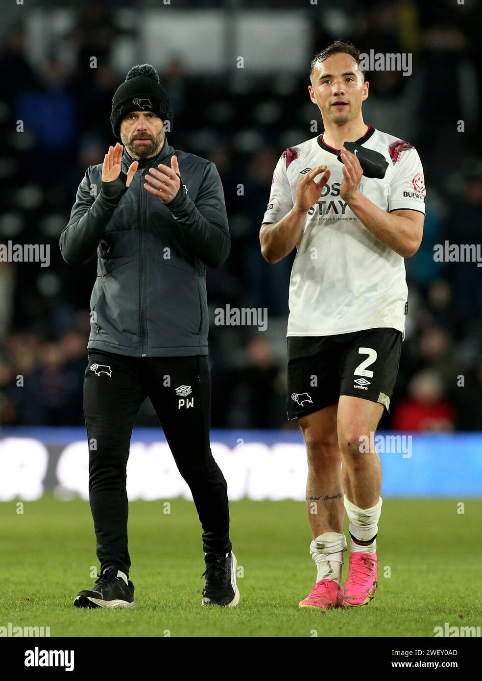 Derby County manager Paul Warne (left) and Kane Wilson applaud the fans ...