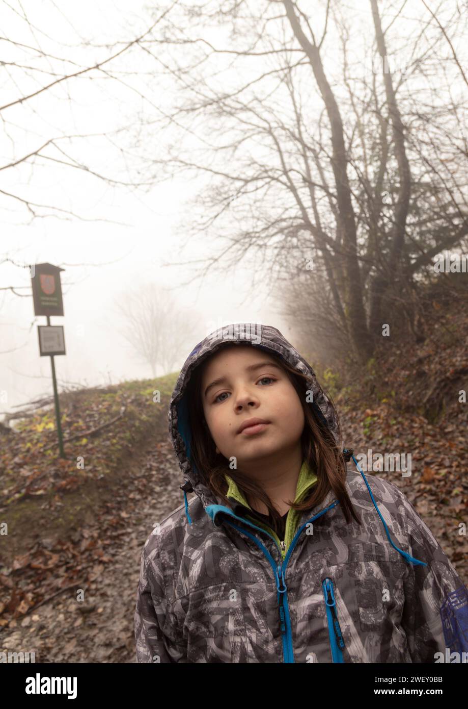 Hooded boy in nature Stock Photo - Alamy