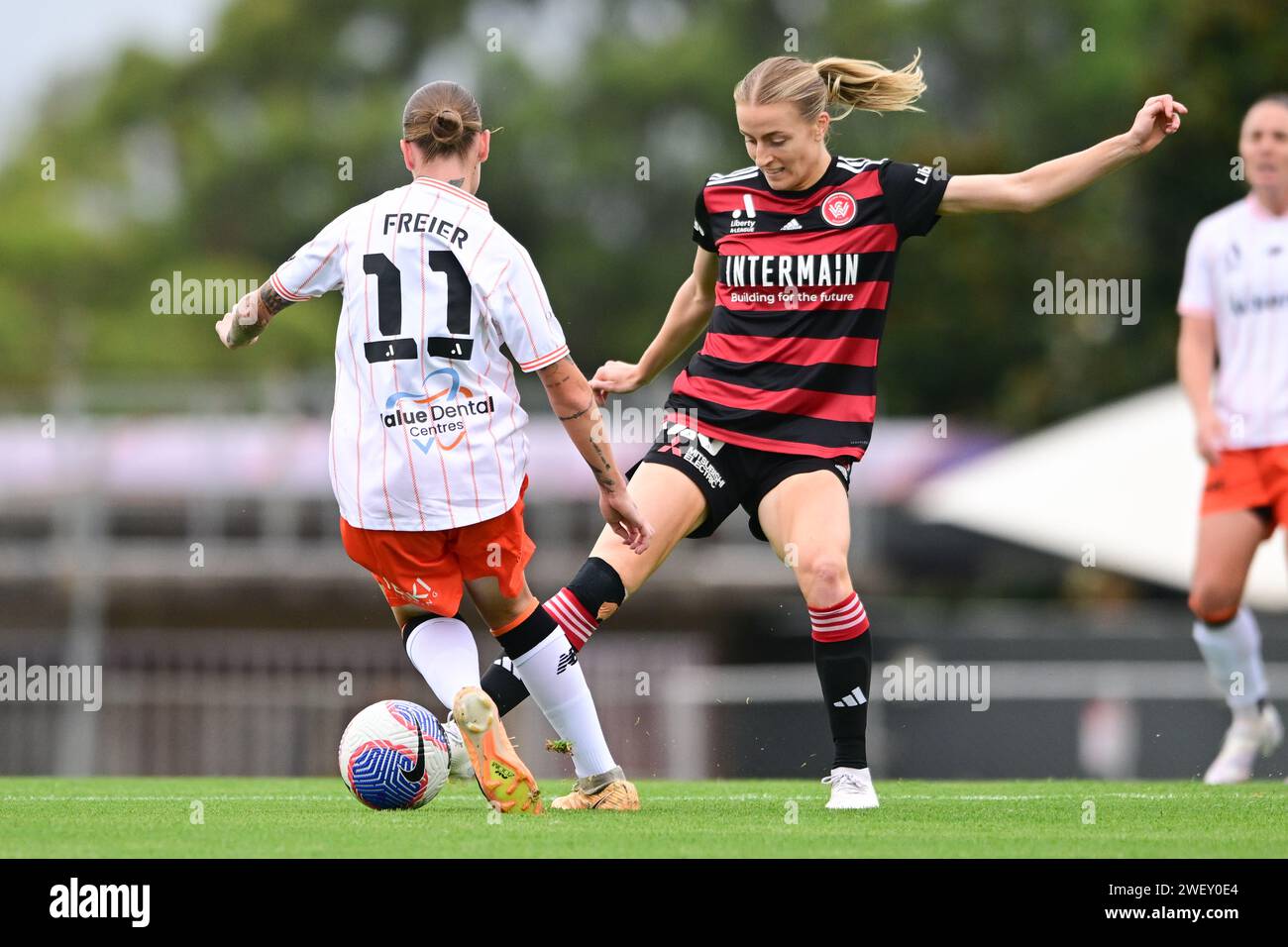 Sharn Freier (L) of Brisbane Roar FC and Holly Caspers (R) of Western ...