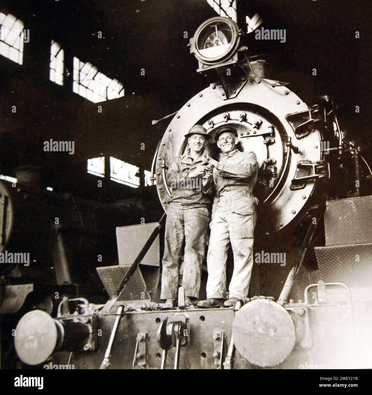 American and British engineers on American train engine somewhere in ...