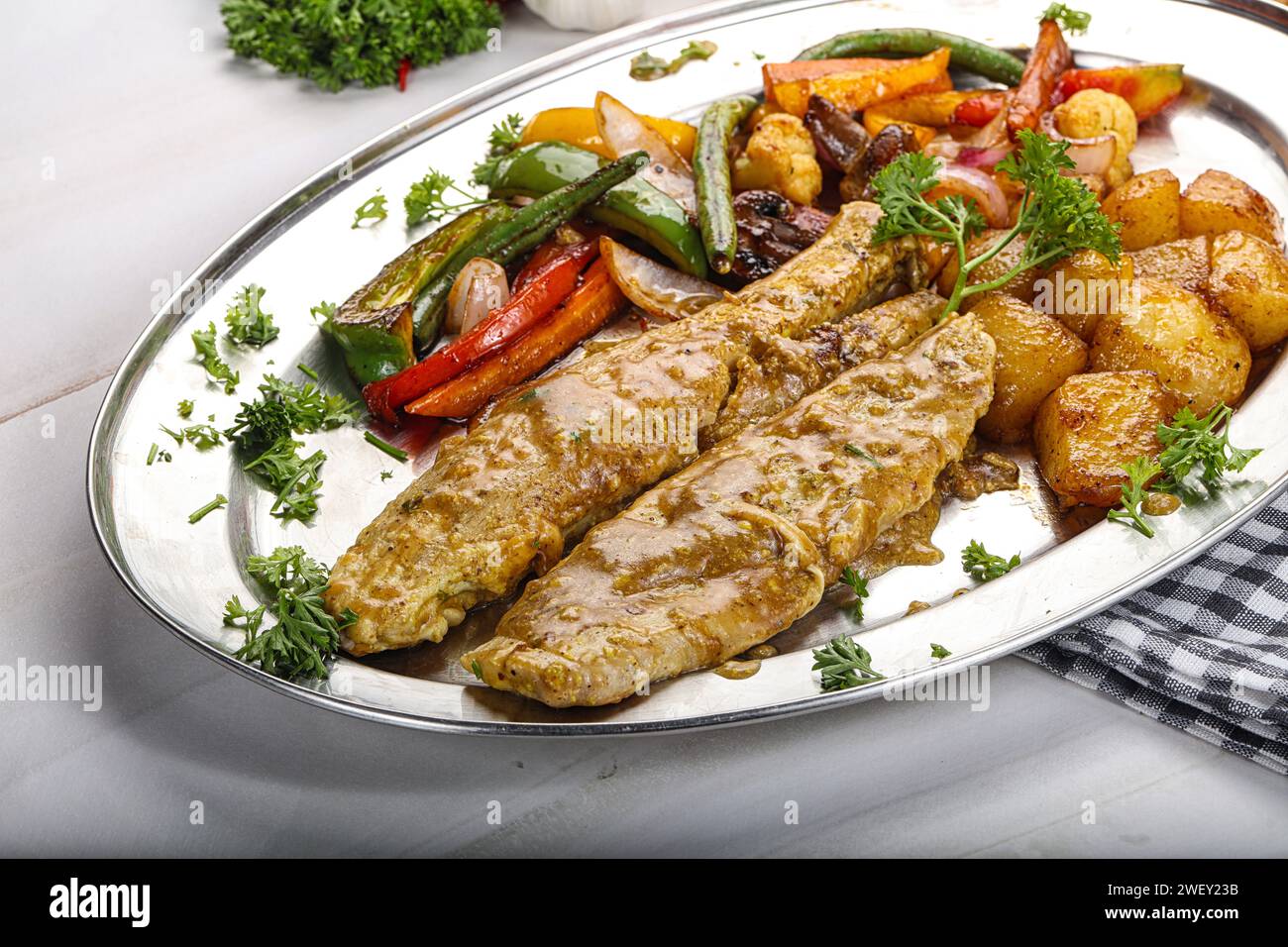 Roasted shark steak with potato and vegetable garnish Stock Photo - Alamy