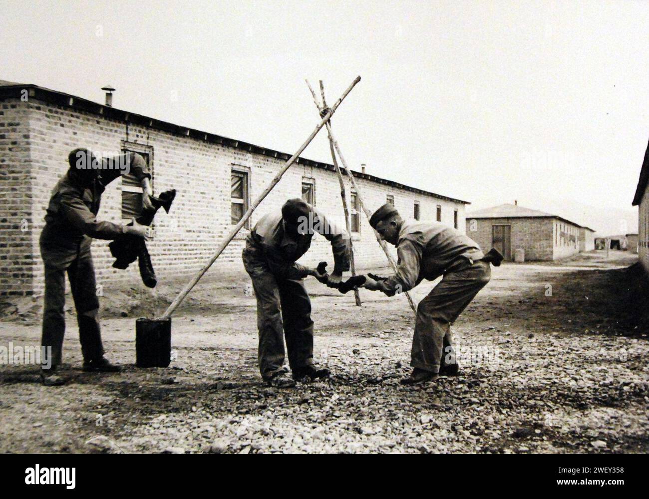 American troops who work on the railway washing out their clothes in ...