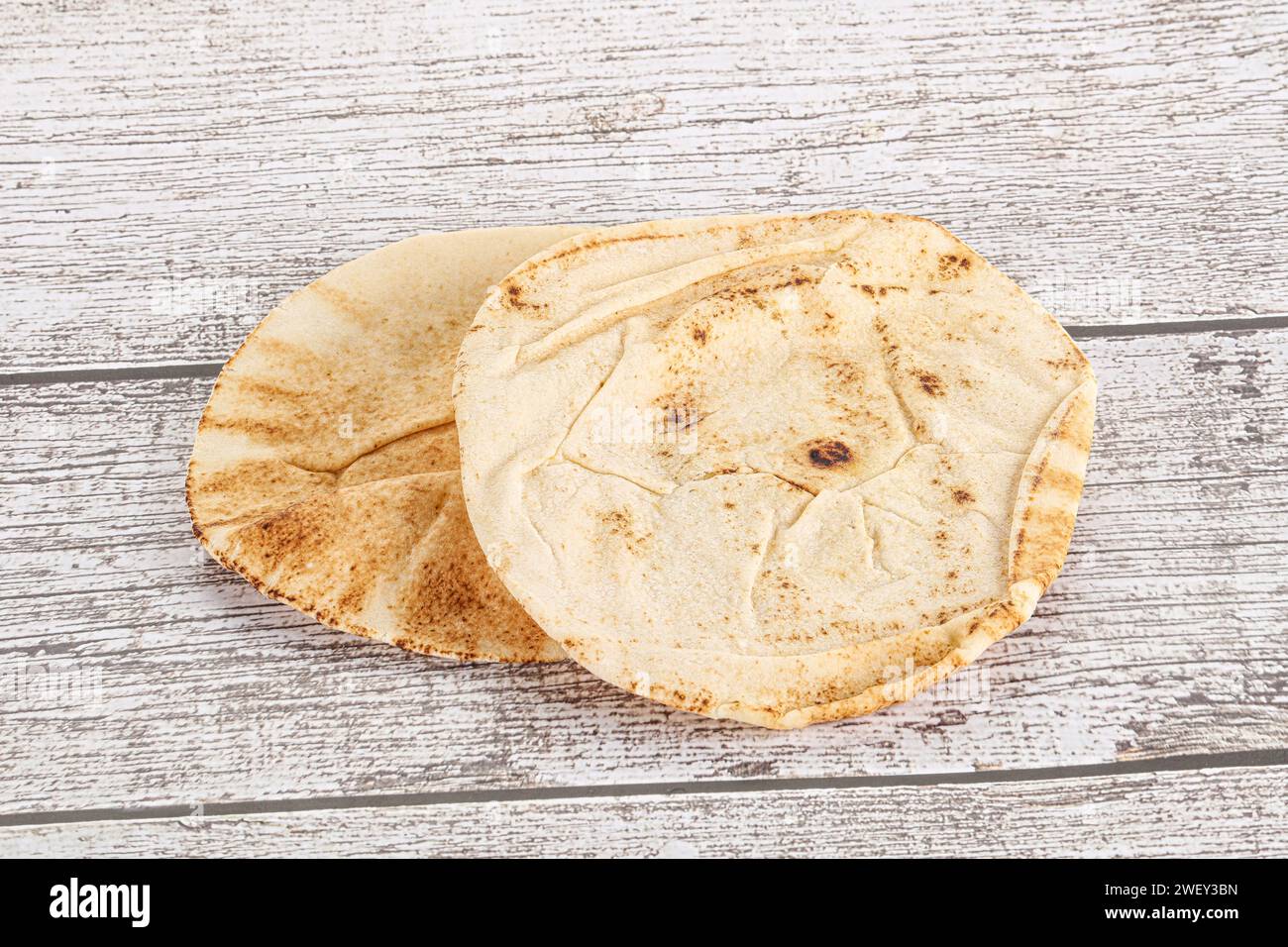 Traditional eastern round pita bread for breakfast Stock Photo - Alamy