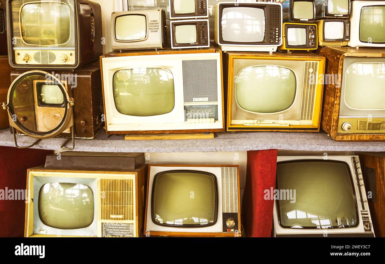 Many retro television. vintage old TV is colorful multi-row. Seeing the ...