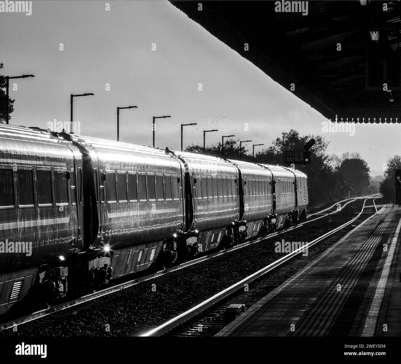 Rising sun glinting off a Chiltern Railways mainline MK3 train at ...