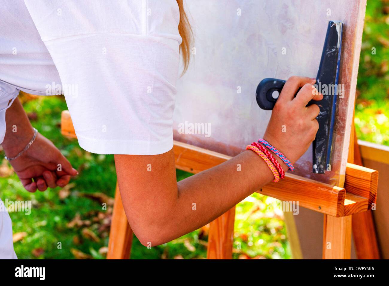 painter, decorator, plasterer. Hand with trowel. Decorative plaster ...