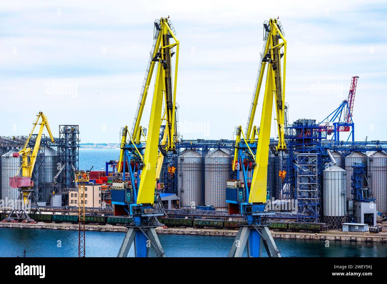 Port Cranes on a Pier of Seaport. Industrial freight.Container terminal ...