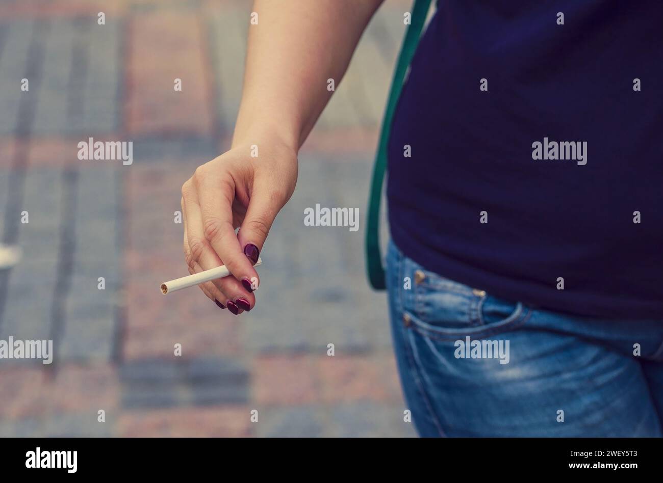 Woman girl holds cigarette hi-res stock photography and images - Alamy