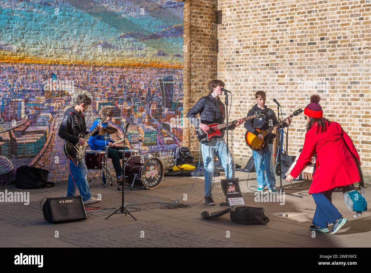 Young buskers musicians group band called The Chalamets playing music ...
