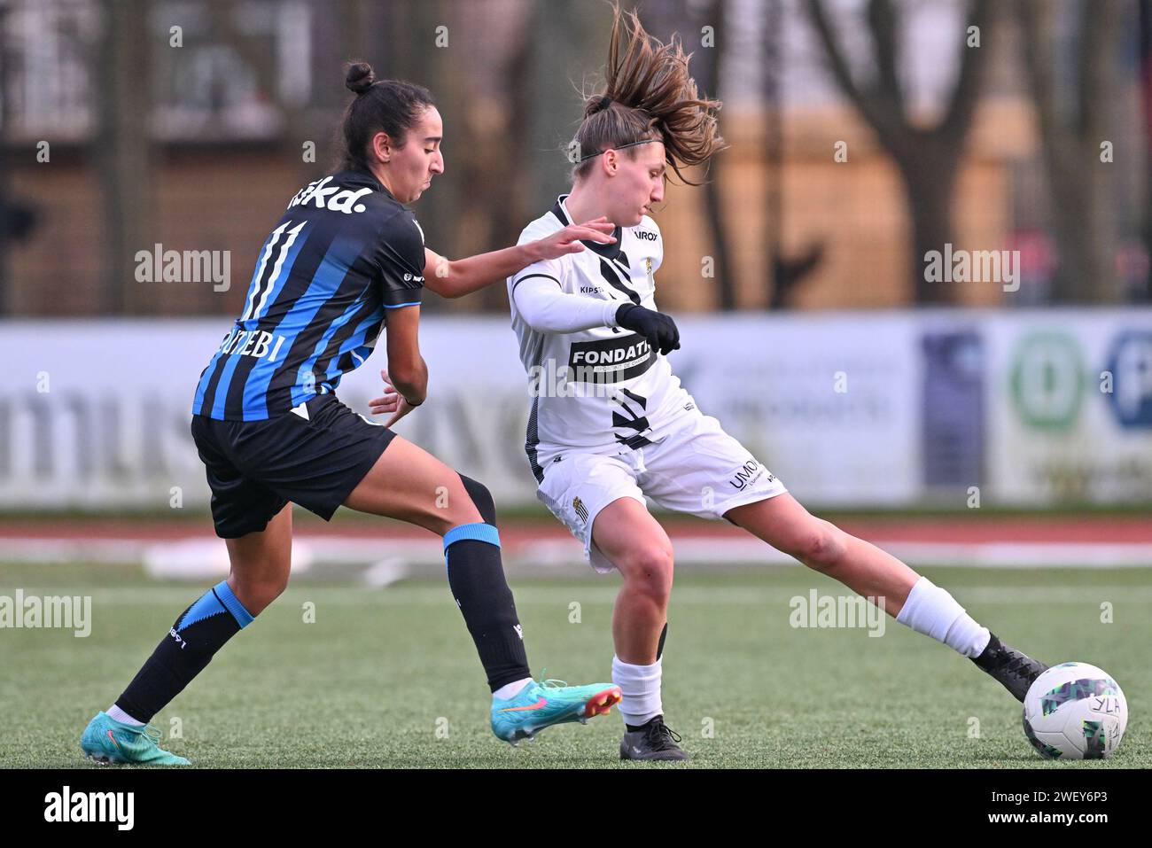 Knokke, Belgium. 27th Jan, 2024. Rania Boutiebi (11) of Club YLA pictured fighting for the ball ...