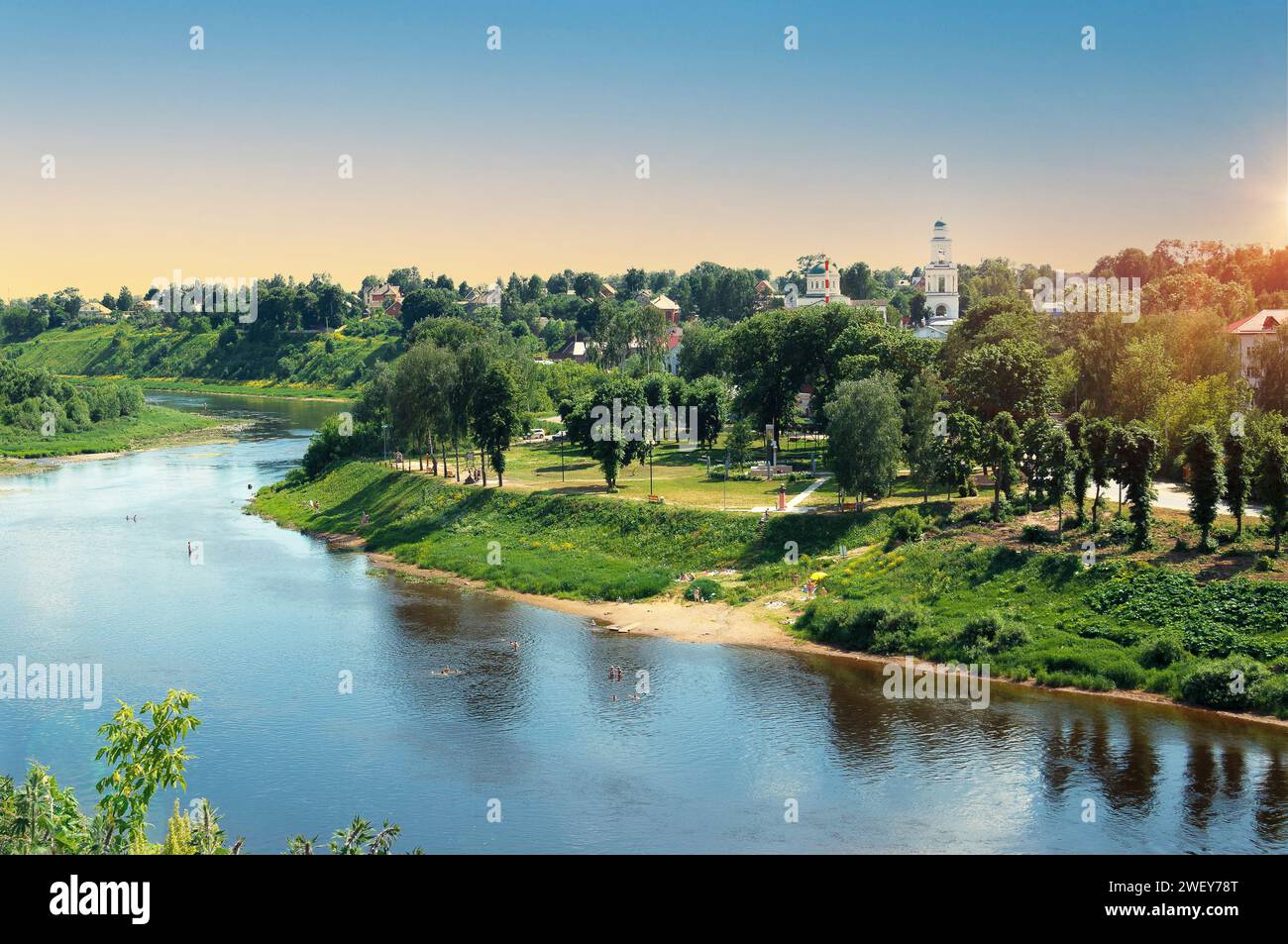red church with blue domes from Rzhev town on the shore surrounded by ...